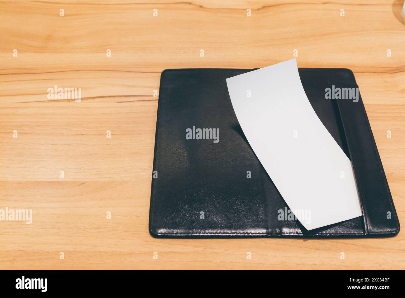 Blank empty white paper in restaurant payment billing receipt folder on ...