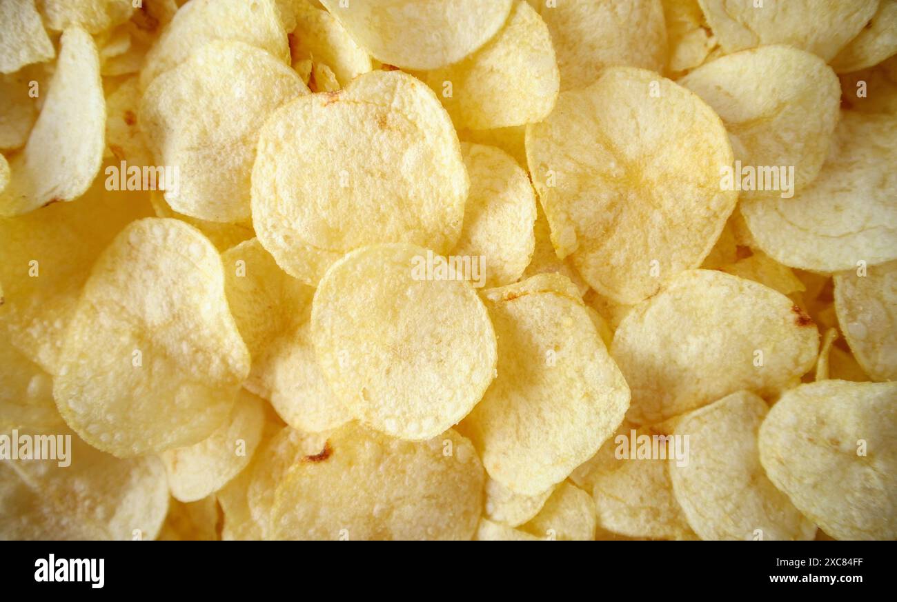 crispy potato chips snack texture background Stock Photo - Alamy