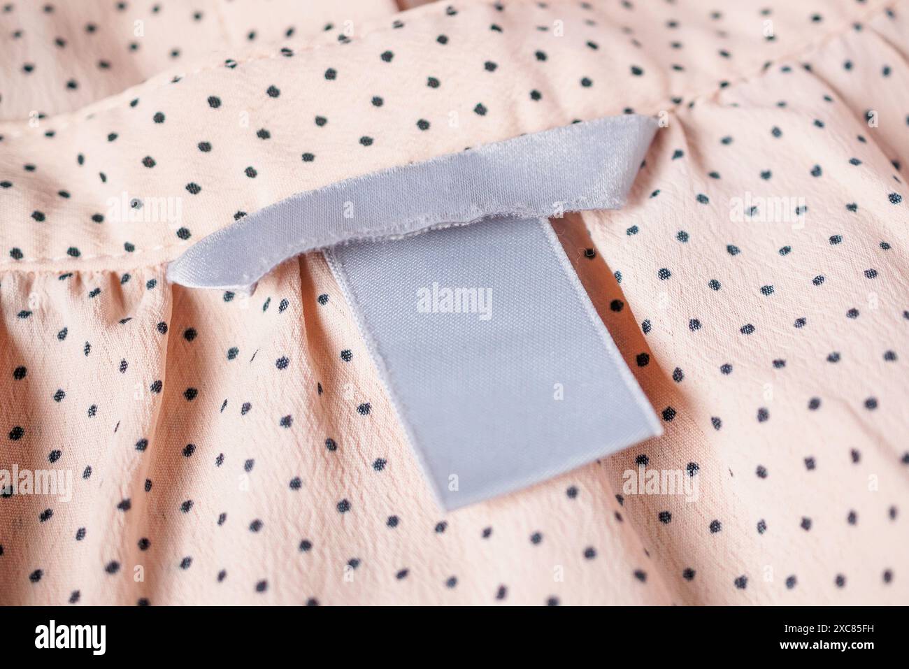 Blank Clothing label closeup on fabric texture Stock Photo - Alamy