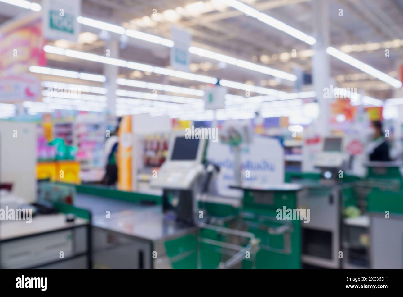 Blur cashier checkout counter in the supermarket Stock Photo - Alamy