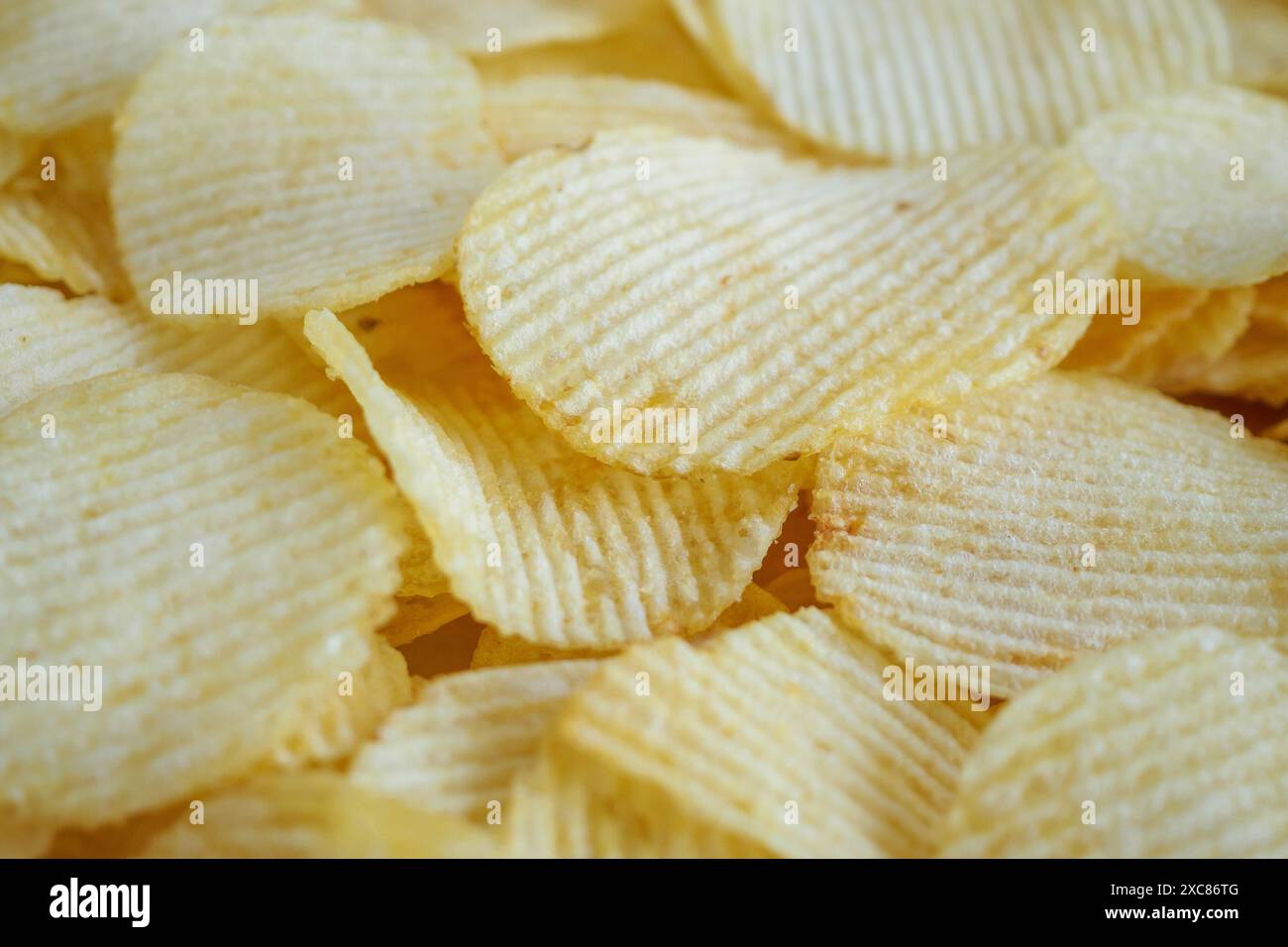 crispy potato chips snack texture background Stock Photo - Alamy