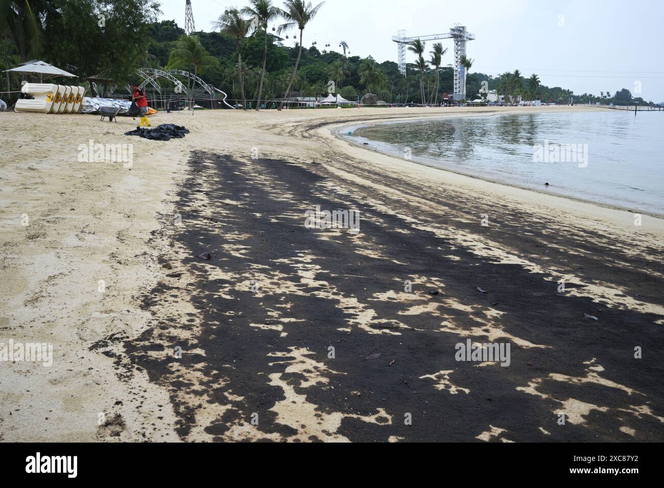 Singapore. 15th June, 2024. Oil stains are seen on Siloso beach of ...