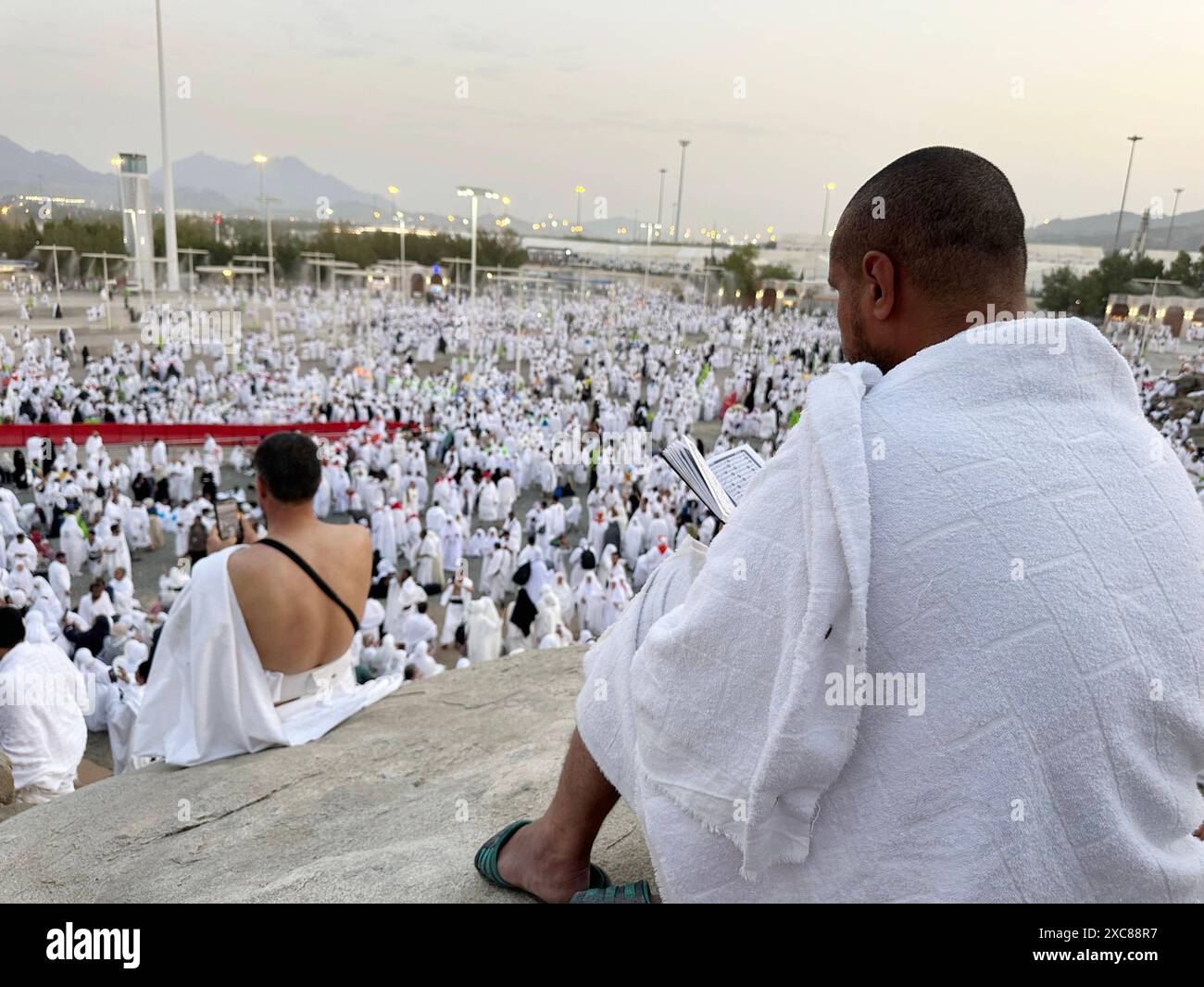 Muslim pilgrims pray at dawn on Saudi Arabia s Mount Arafat, also known as Jabal al-Rahma or ...