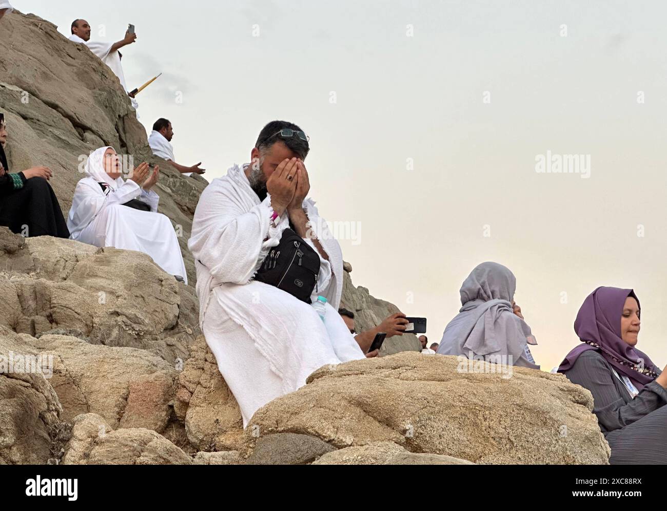 Muslim pilgrims pray at dawn on Saudi Arabia s Mount Arafat, also known as Jabal al-Rahma or ...