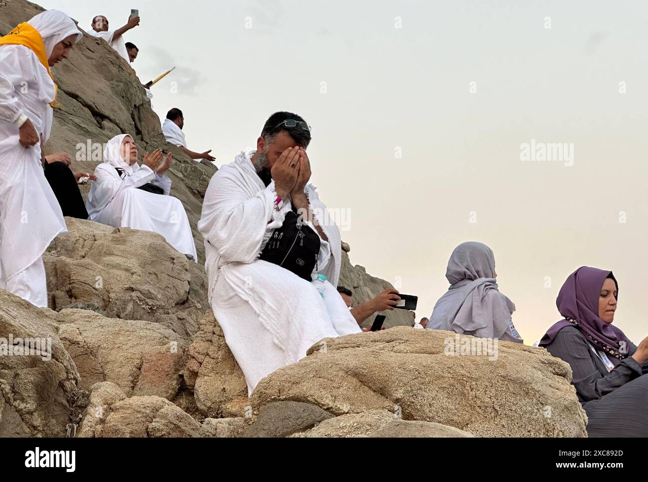 Muslim pilgrims pray at dawn on Saudi Arabia s Mount Arafat, also known ...