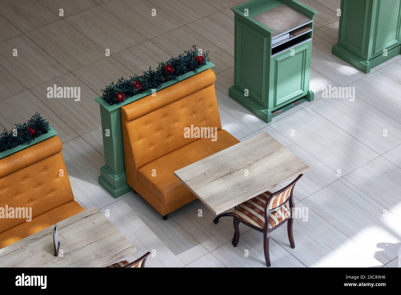 An aerial image showing an outdoor restaurant setup with wooden tables ...