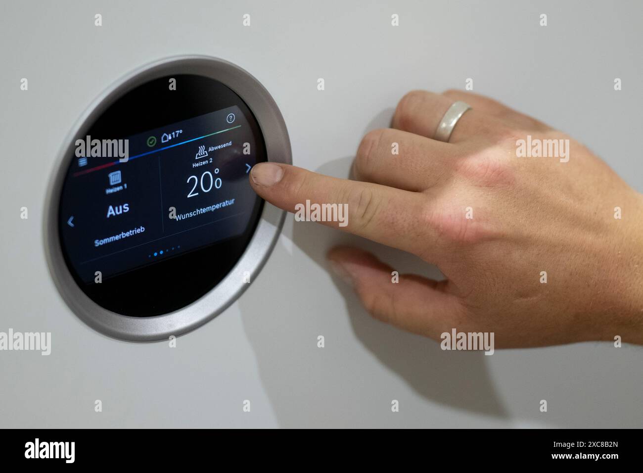 Blankenfelde Mahlow, Germany. 14th June, 2024. A tradesman points to ...