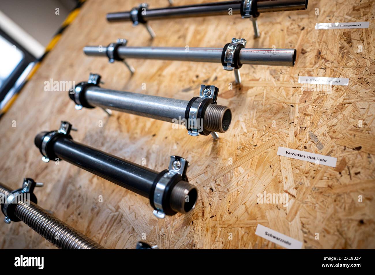 14 June 2024, Brandenburg, Blankenfelde-Mahlow: Various pipes hang on a ...