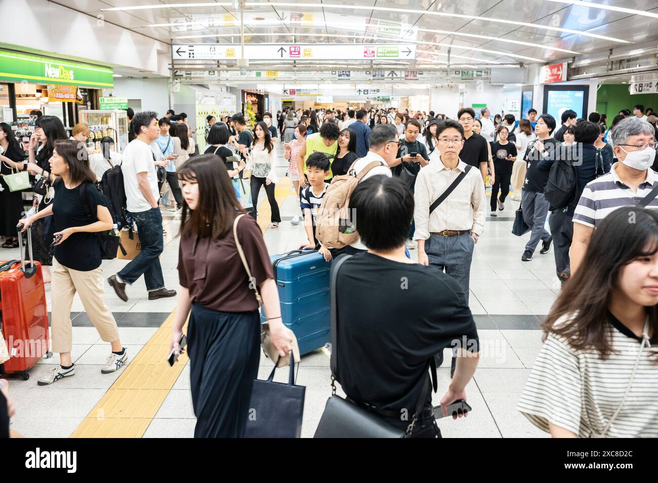 Tokyo, Japan, June 13, 2024: Commuters travel through Shinjuku Station ...