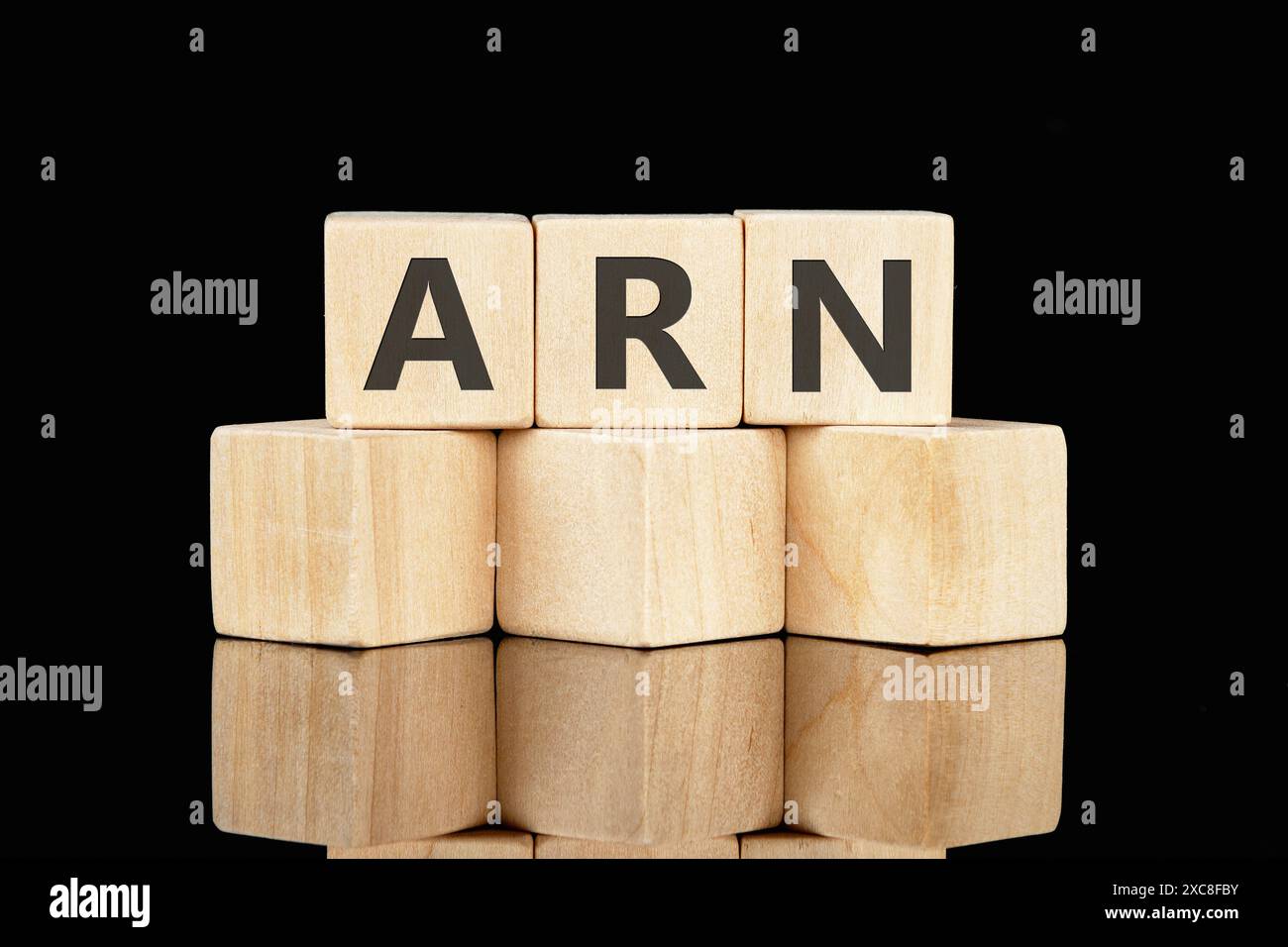 ARN as Account Reference Number word is made up of wooden cubes on a ...