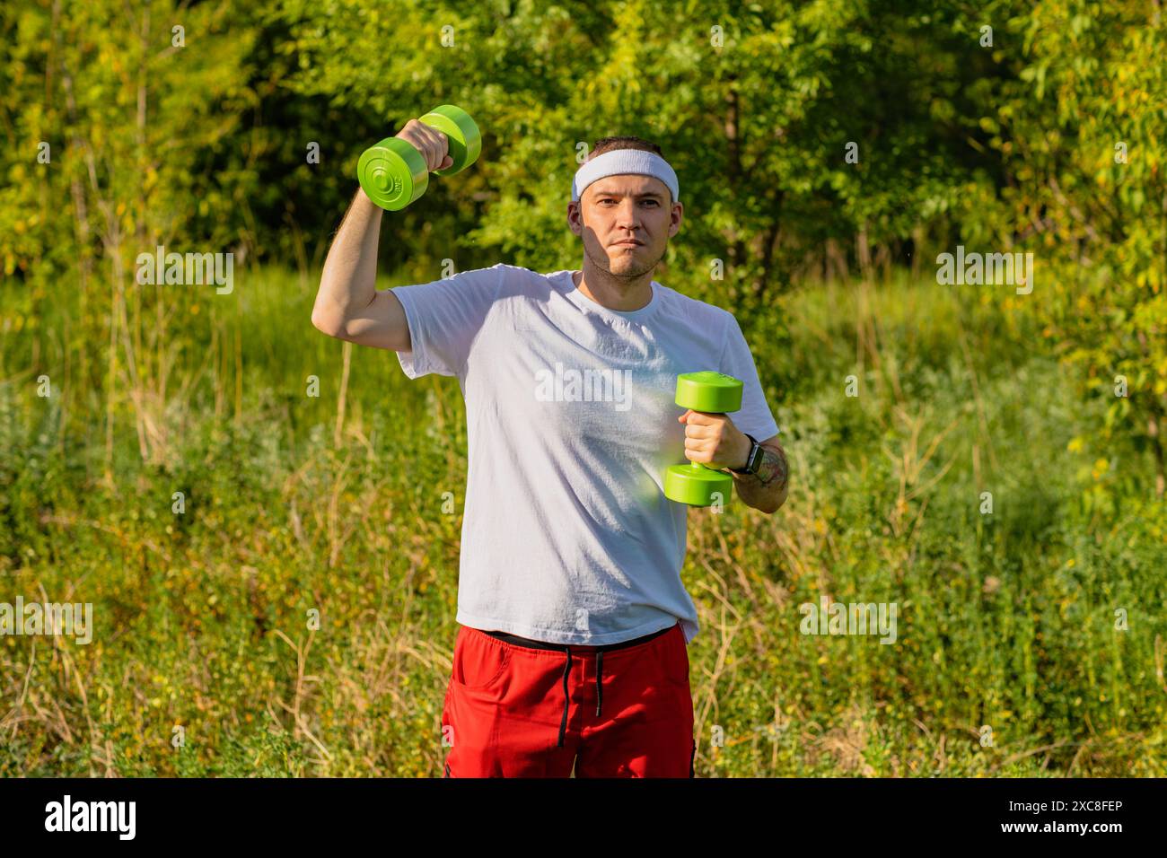 Man lifts weights hi-res stock photography and images - Alamy