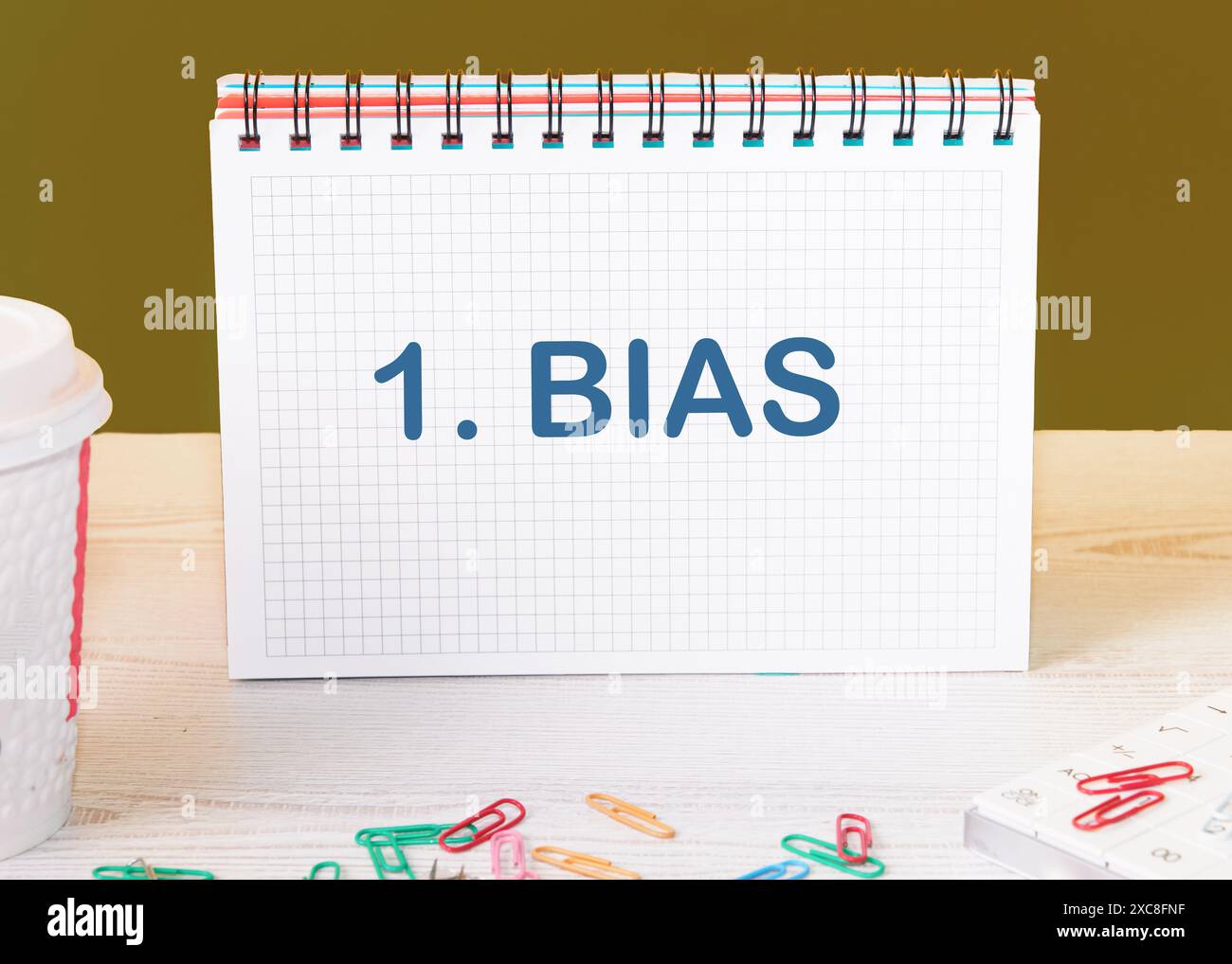 Business bias concept. Word BIAS written on a checkered notebook on the ...