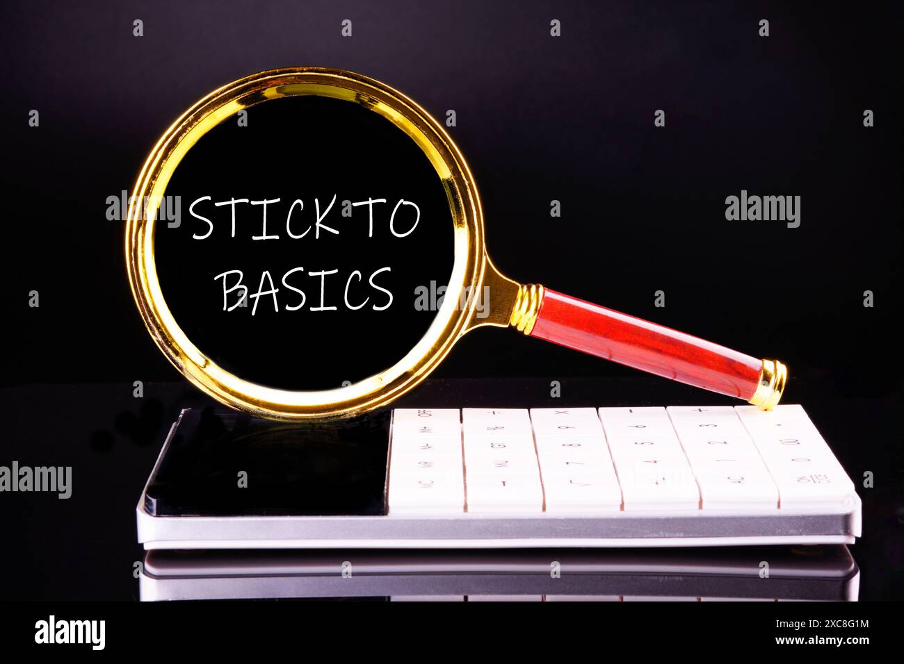 Finance and economics concept. Text STICK TO BASICS appeared through a ...