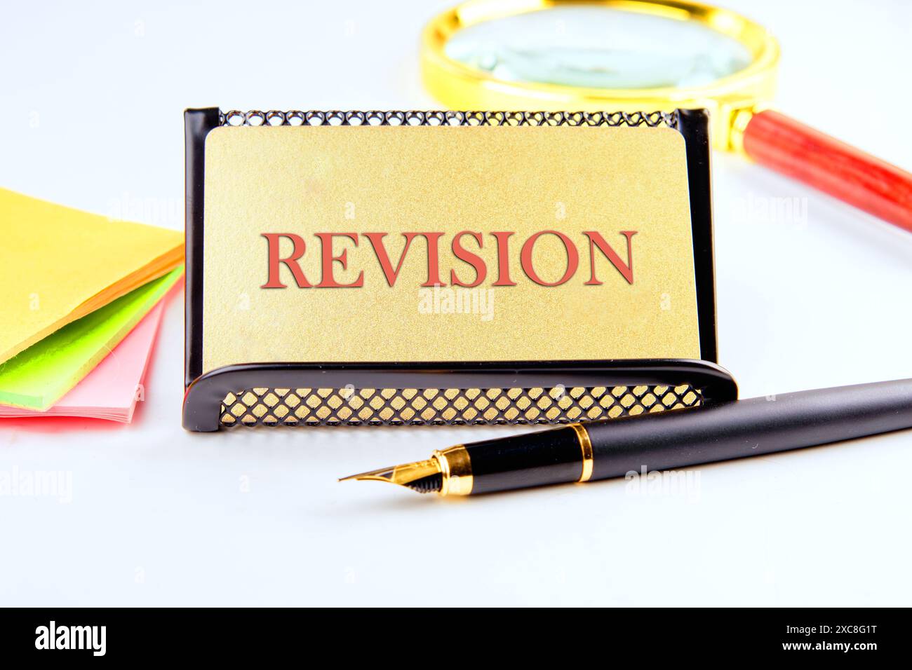 Concept Word REVISION on the golden card Stock Photo - Alamy