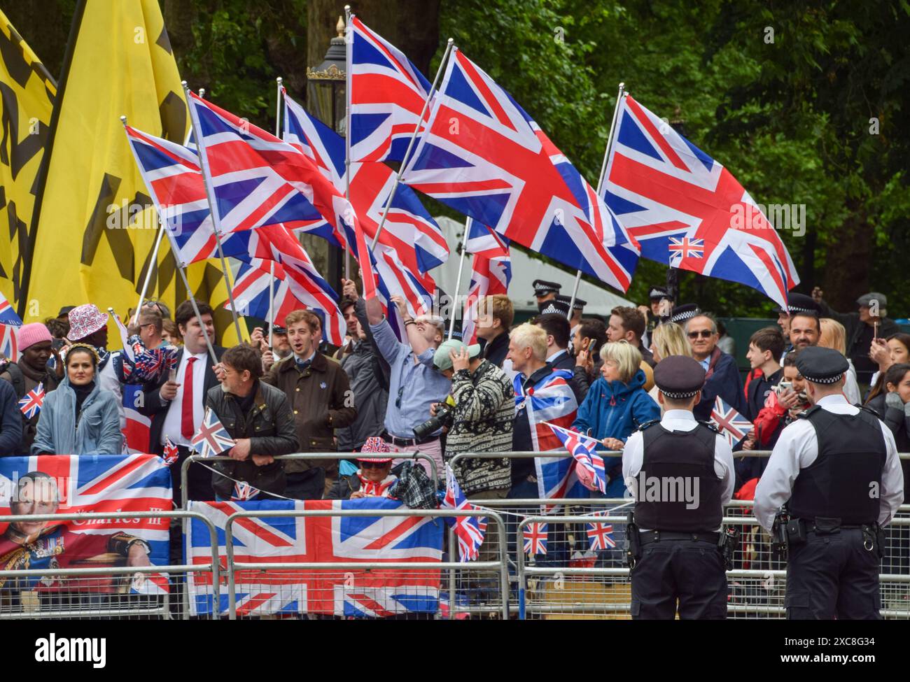 London, England, UK. 15th June, 2024. Royal supporters wave Union Jacks ...