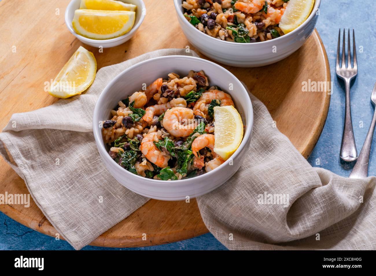 Prawn and chorizo risotto with black beans and calvo nero Stock Photo ...