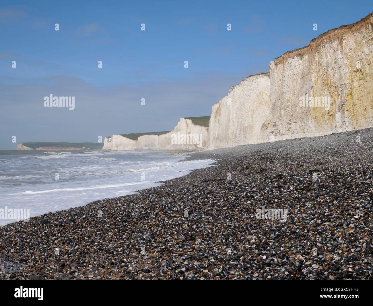 Scenic view of Seven Sisters cliffs towering above the beach at Birling ...