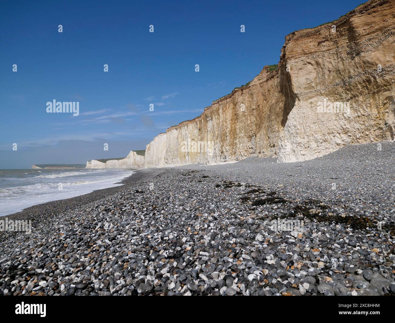Scenic view of Seven Sisters cliffs towering above the beach at Birling ...