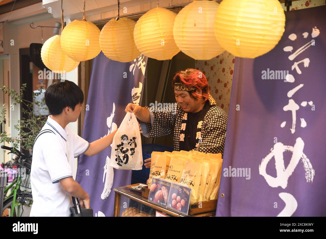 Japanese man selling melonpan, a sweetbun made from an enriched dough ...