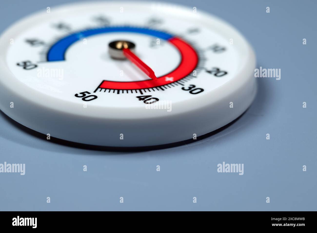 Thermometer over 30 degrees Celsius with sun in blue sky Stock Photo ...