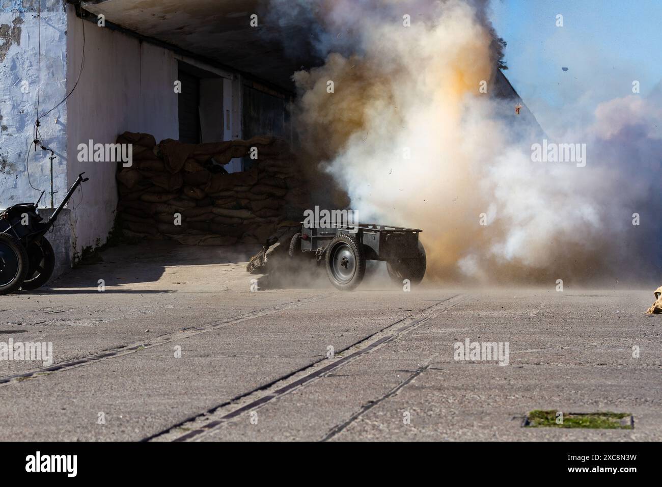 Background. Bombs exploding in a city. Reconstruction of a World War II ...