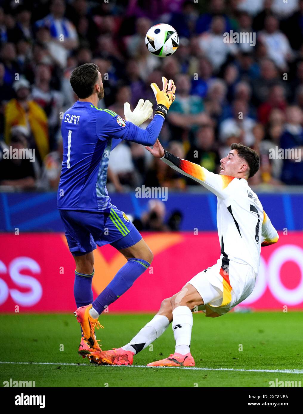 Scotland goalkeeper Angus Gunn saves the ball from Germany's Kai ...