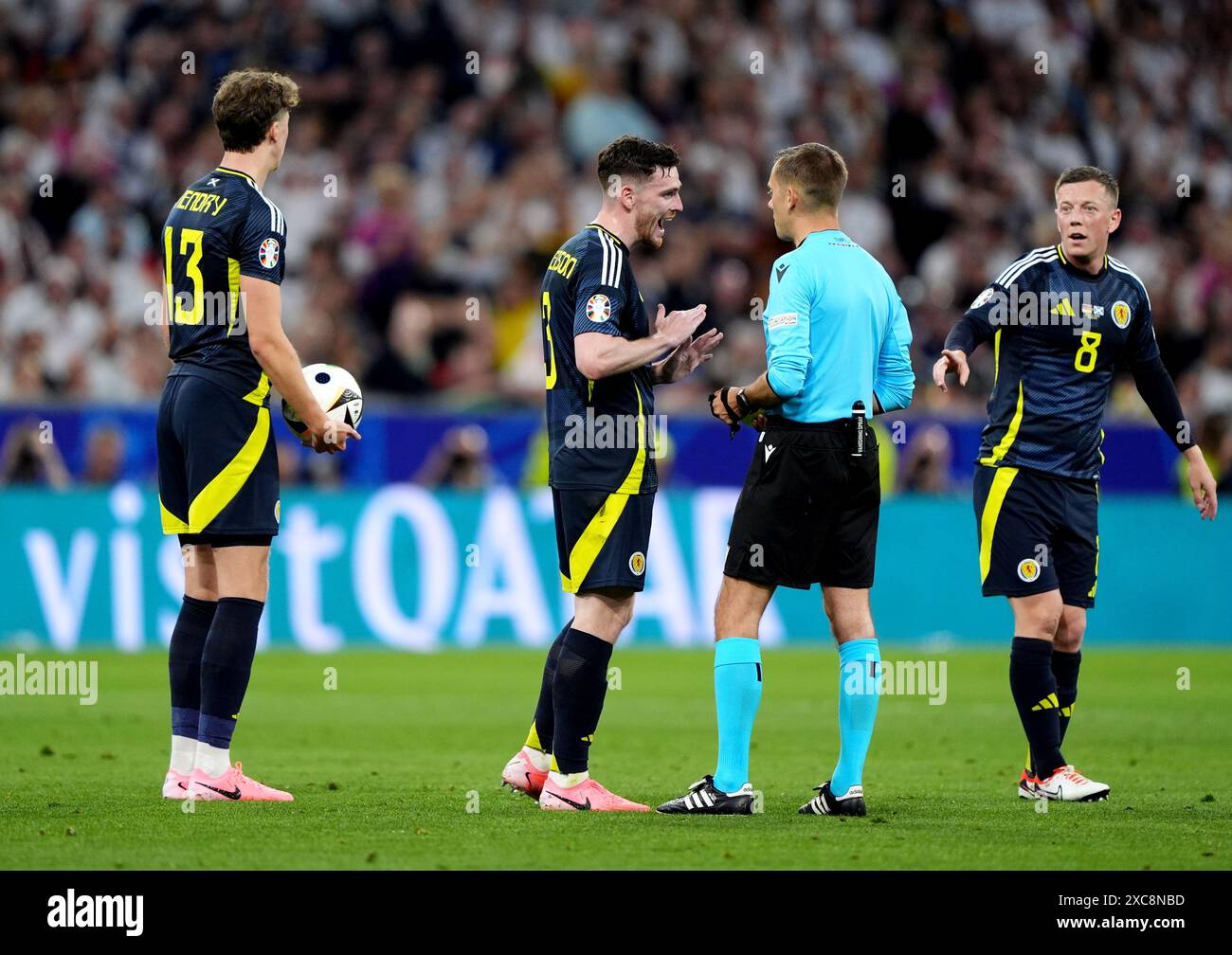 Scotland's Andrew Robertson speaks to referee Clement Turpin during the ...