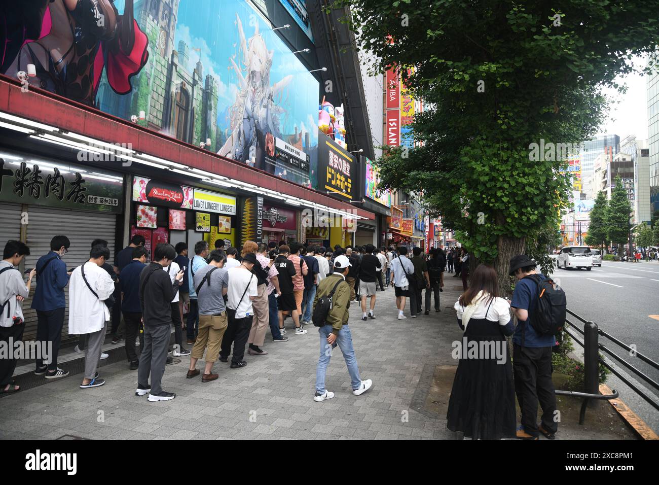 People waiting for a shop to open in Akihabara, a famous area for ...