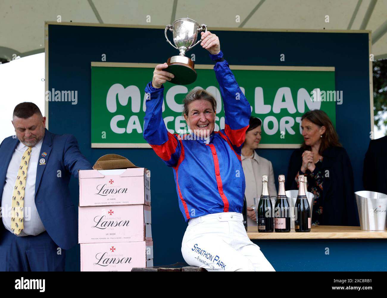 Jockey Serena Brotherton collects the trophy and her weight in ...