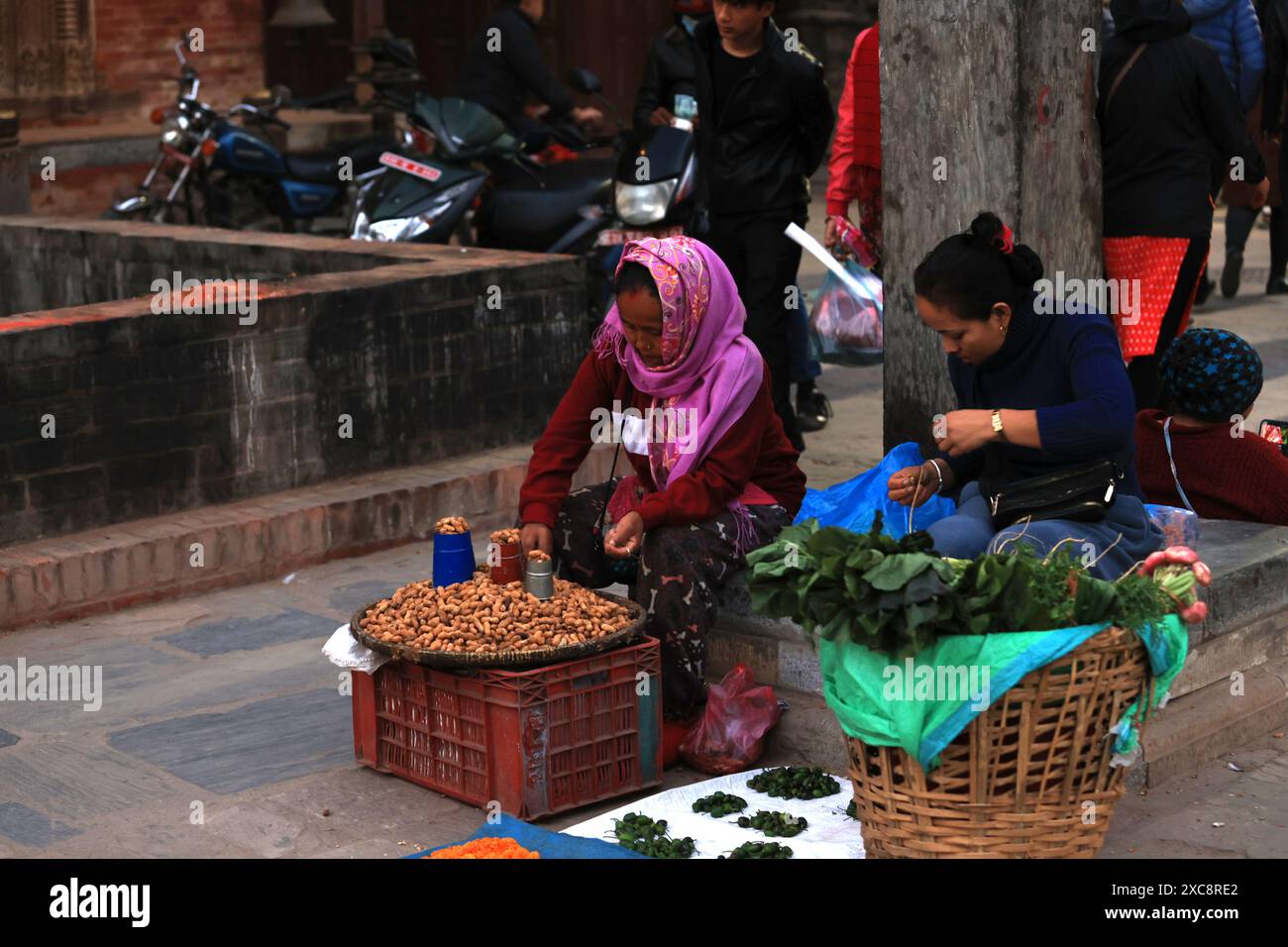 Kathmandu, Nepal November 20 2023: hawker sell the local food and sweet ...