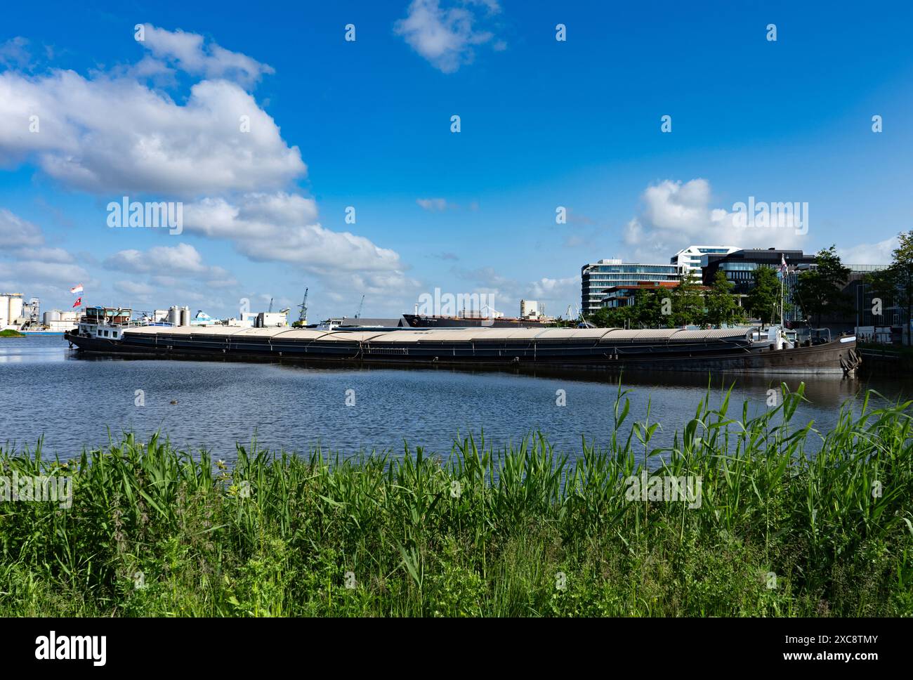 A moored barge on a canal in the Netherlands Stock Photo - Alamy