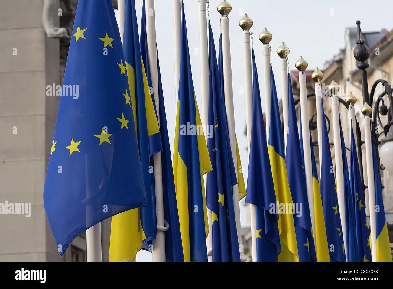 Flags of Ukraine and the European Union on flagpoles near the office of ...