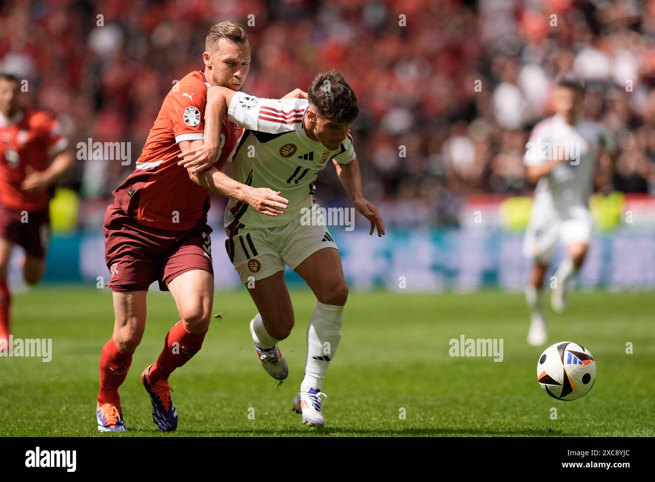 Cologne, Germany. 15th June, 2024. Switzerland's Silvan Widmer fights ...