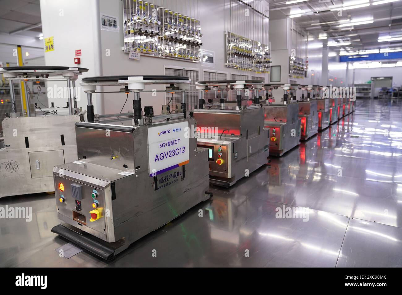 Nanchang. 4th June, 2024. An AGV (automated guided vehicle) conducts ...