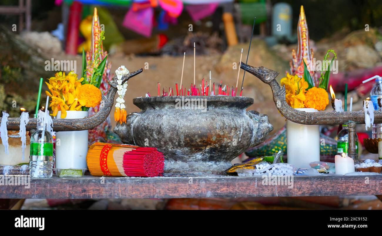 Bowl of incense in the Princess Cave, a buddhist temple on Phra Nang ...