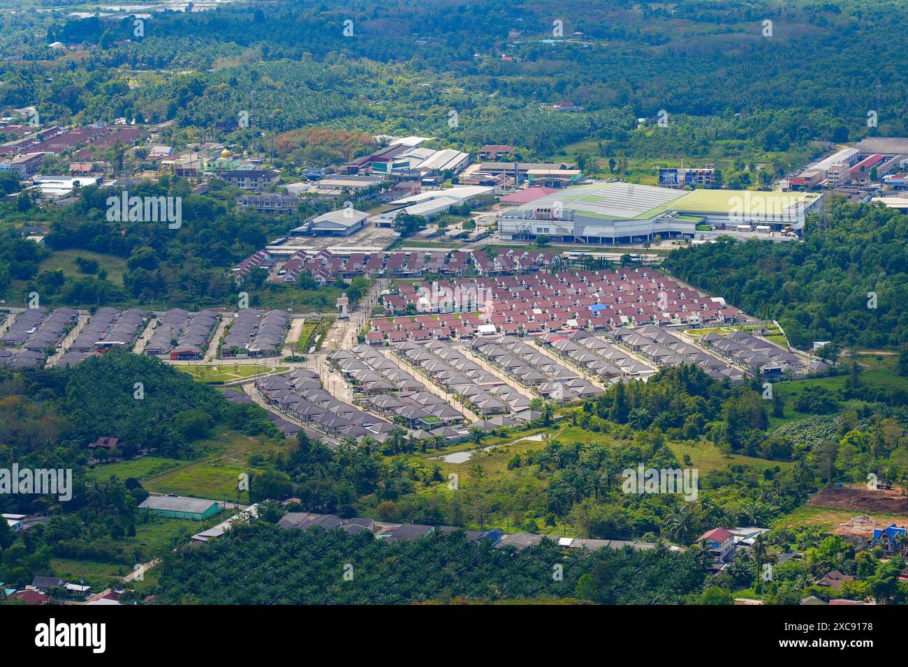 Real estate development with rows of identical modern houses seen from ...
