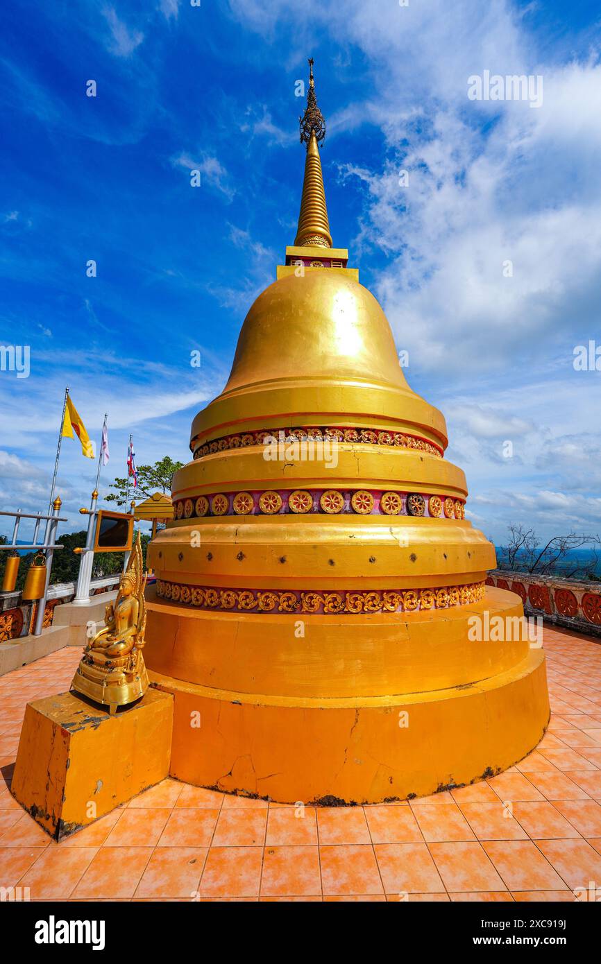 Golden stupa (shrine) in the shape of a bell at the hilltop pagoda of ...