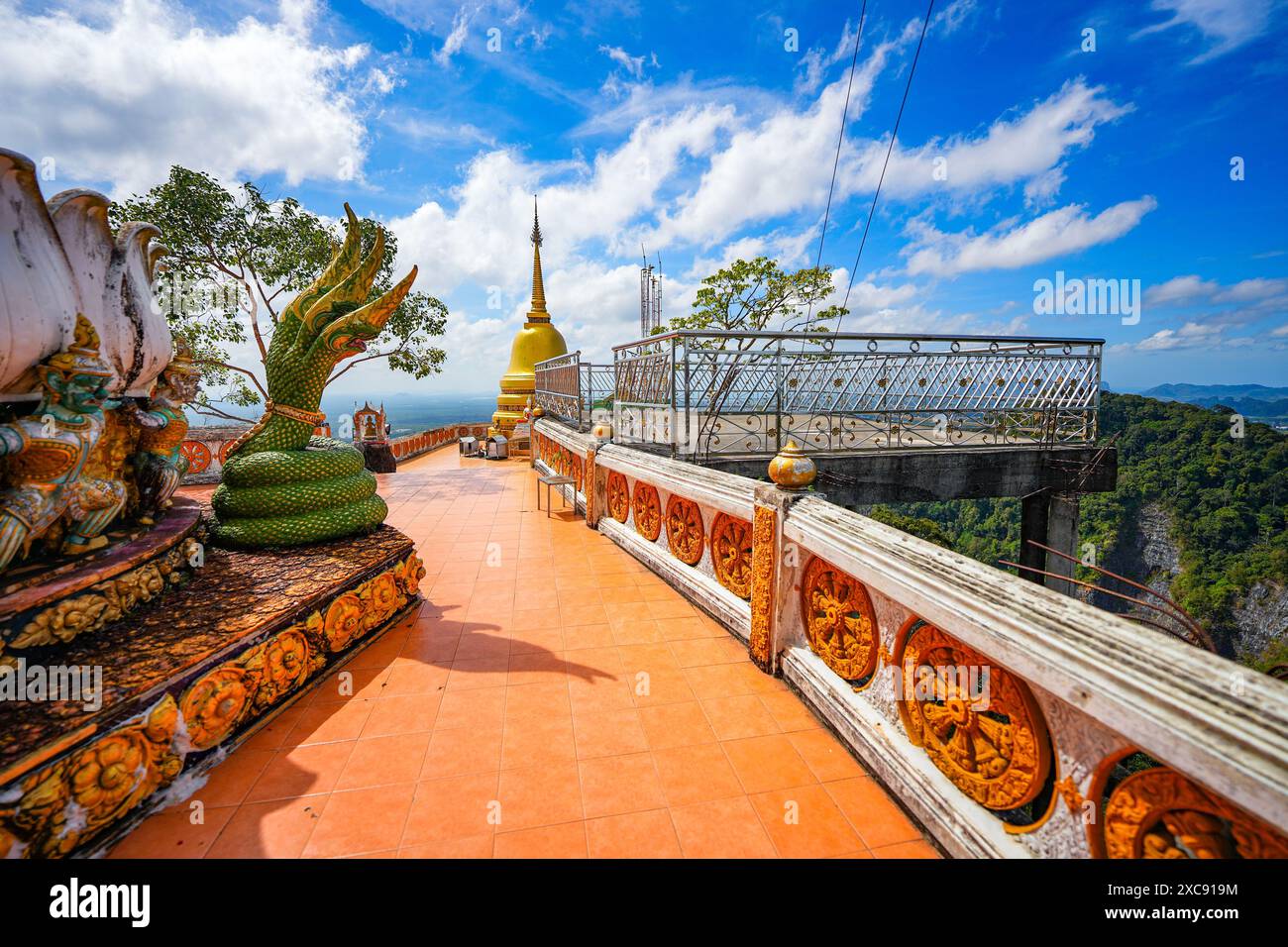 Golden stupa (shrine) in the shape of a bell at the hilltop pagoda of ...