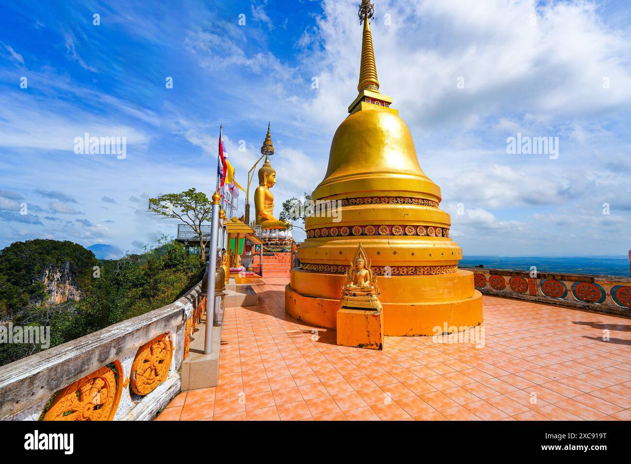 Golden stupa (shrine) in the shape of a bell at the hilltop pagoda of ...