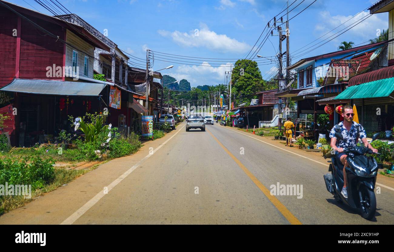 Winding road passing through a traditional village surrounded by ...