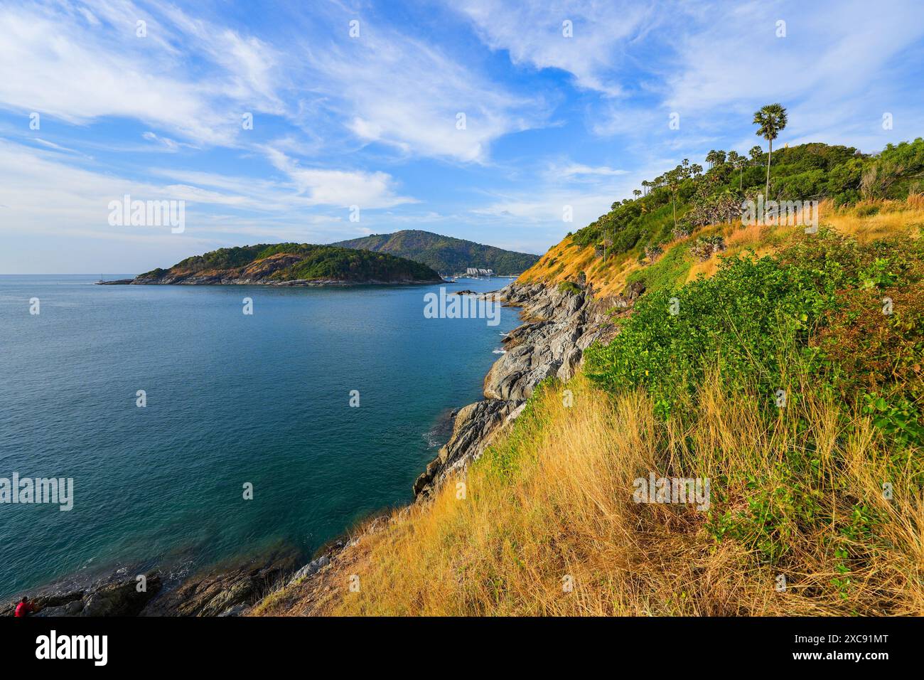 Grassy cliff on Promthep Cape, the southernmost point of Phuket island ...