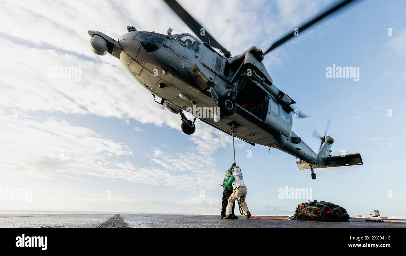 An MH-60S Seahawk, assigned to Helicopter Sea Combat Squadron (HSC) 5 ...
