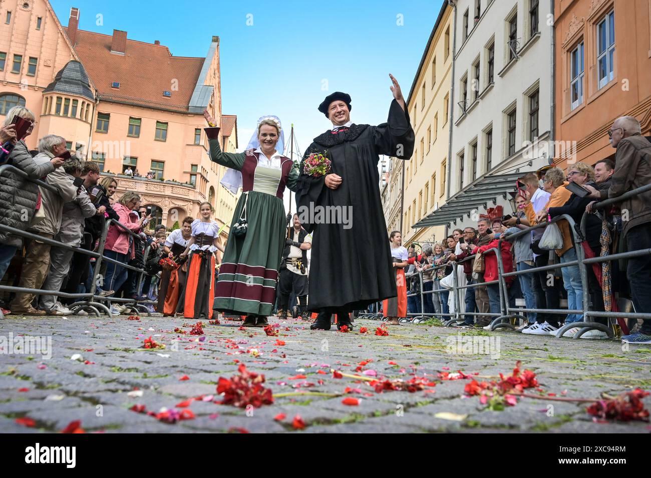 15 June 2024, Saxony-Anhalt, Lutherstadt Wittenberg: The bridal couple ...