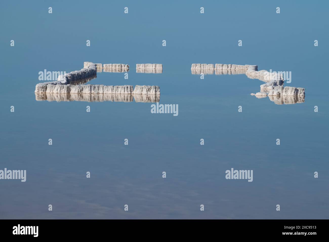 Remains of old mud baths covered with salt on salt lake of Elton on a ...
