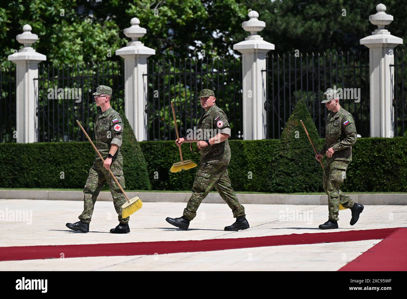 Bratislava, Slovakia. 15th June, 2024. Soldiers prepare a red carpet in ...