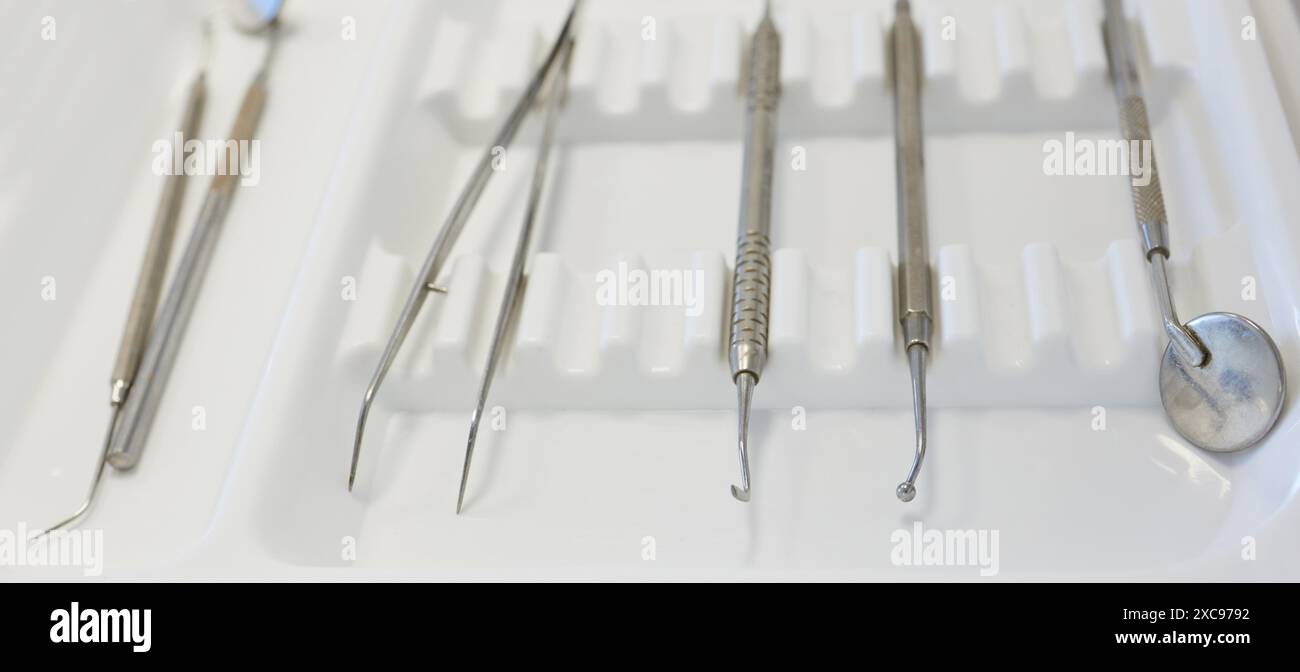 Closeup, metal and dental tools for healthcare with excavator and ...