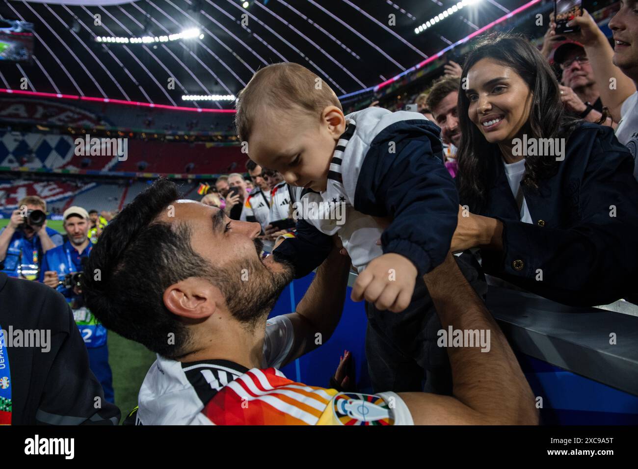 MUNICH, GERMANY - JUNE 14: İlkay Gundogan with his son and wife Sara ...