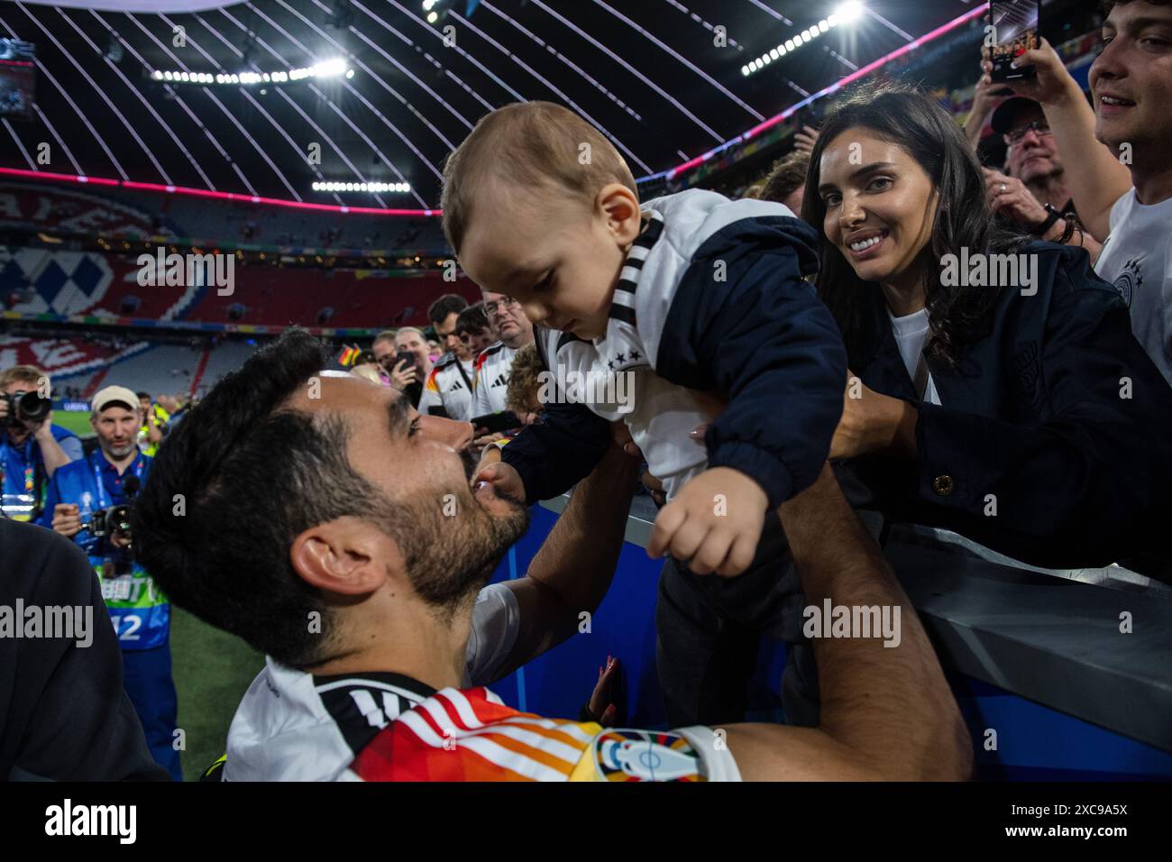 MUNICH, GERMANY - JUNE 14: İlkay Gundogan with his son and wife Sara ...