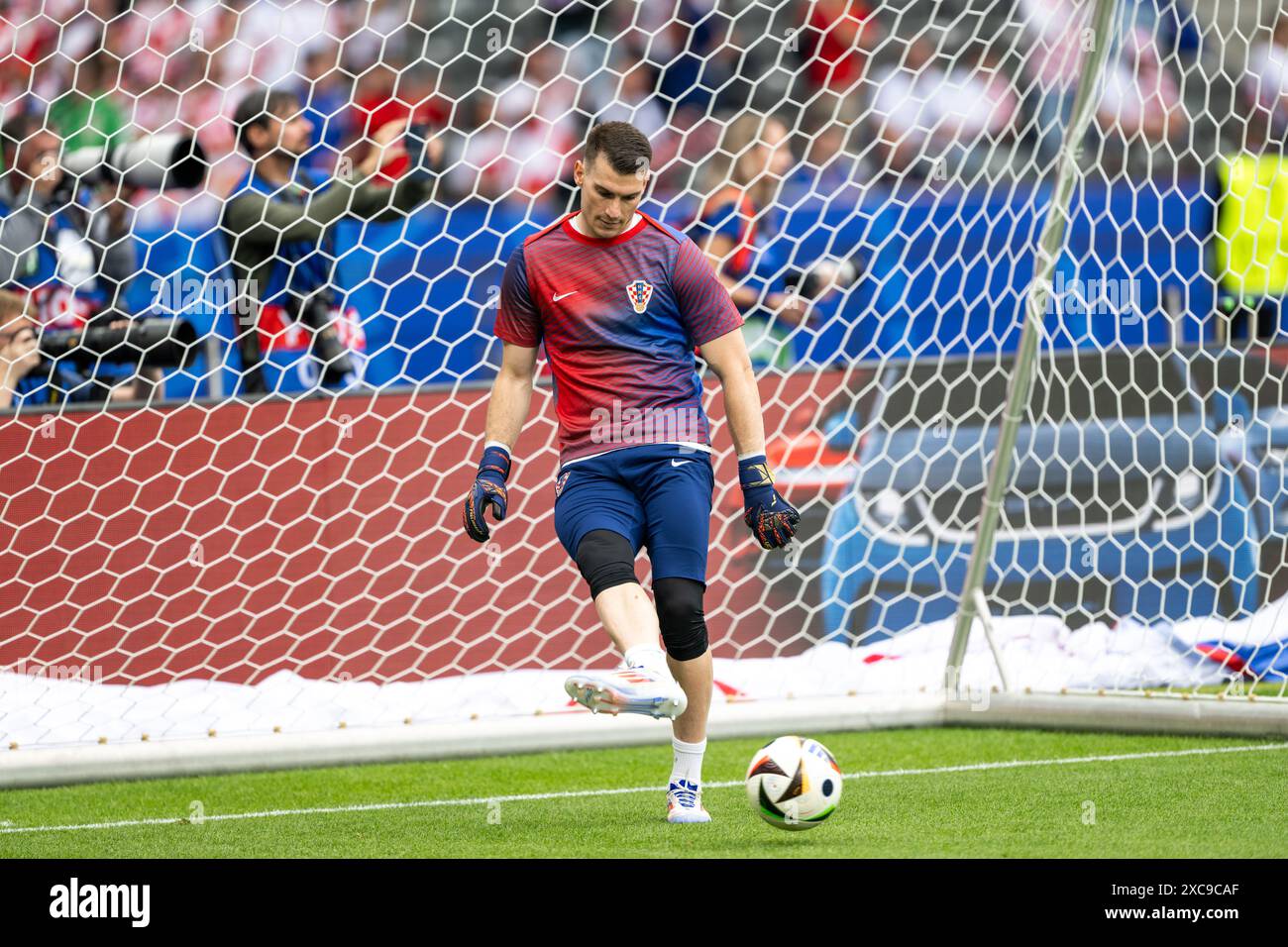 Berlin, Germany. 15th June, 2024. Goalkeeper Dominik Livakovic of Croatia is warming up before ...