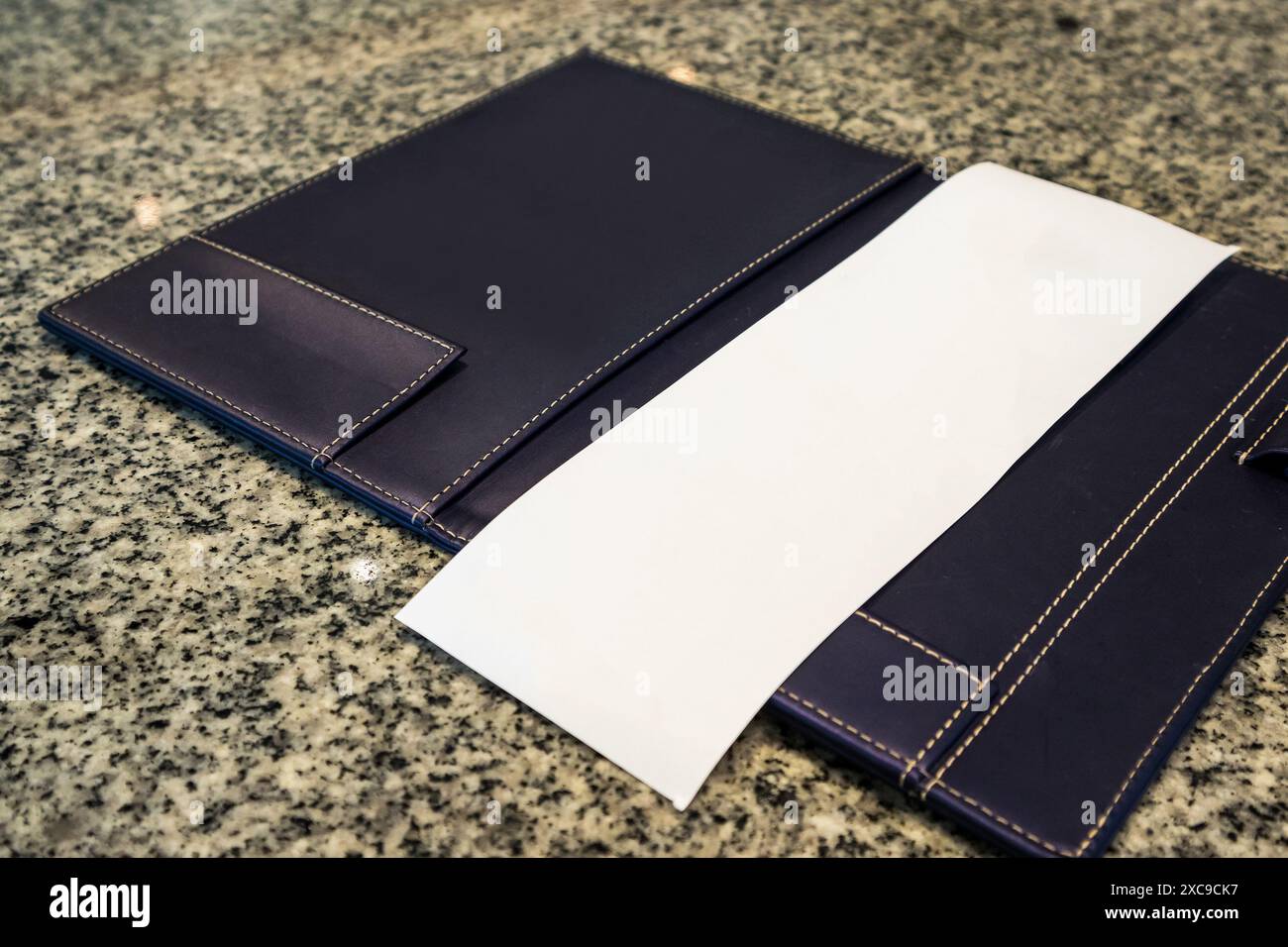 Blank empty white paper in restaurant payment billing receipt folder on ...